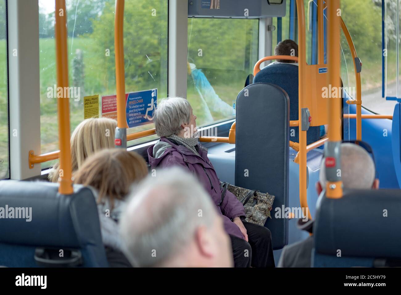 Park and ride bus interior, showing seated passengers travelling to ...