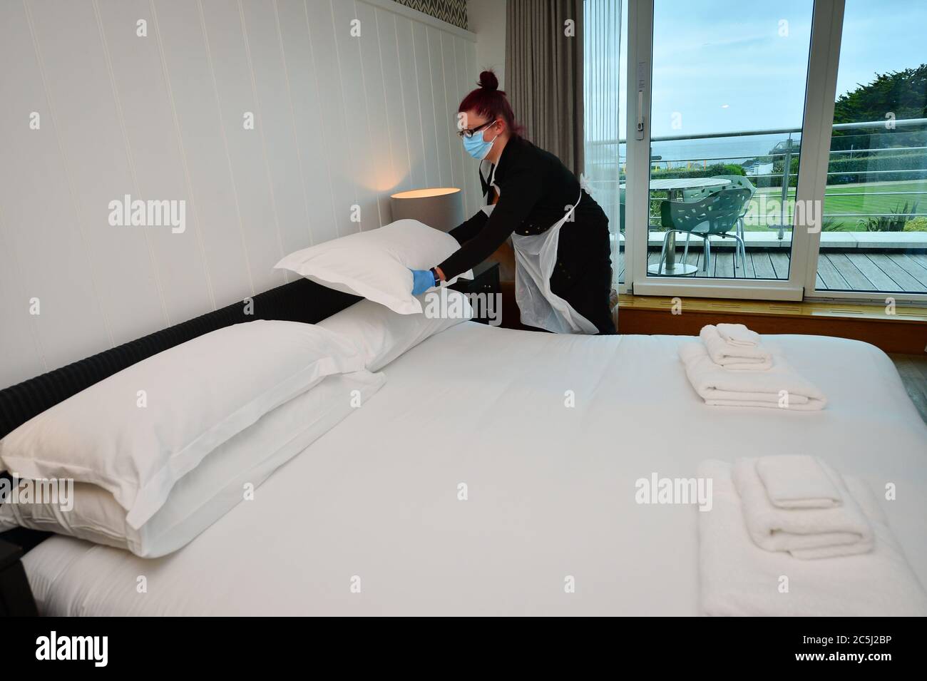 Wears ppe she cleans hi-res stock photography and images - Alamy