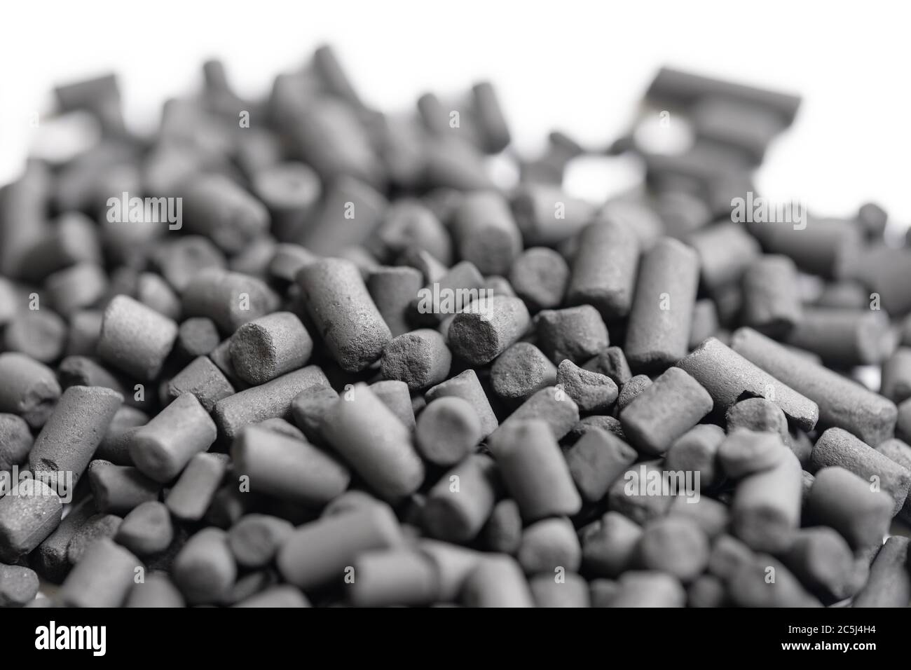 Macro view of small activated Carbon granules seen in a heap. Used in ...