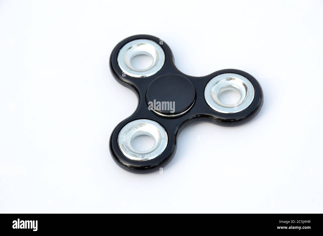 the black silver spinner isolated on white background Stock Photo - Alamy