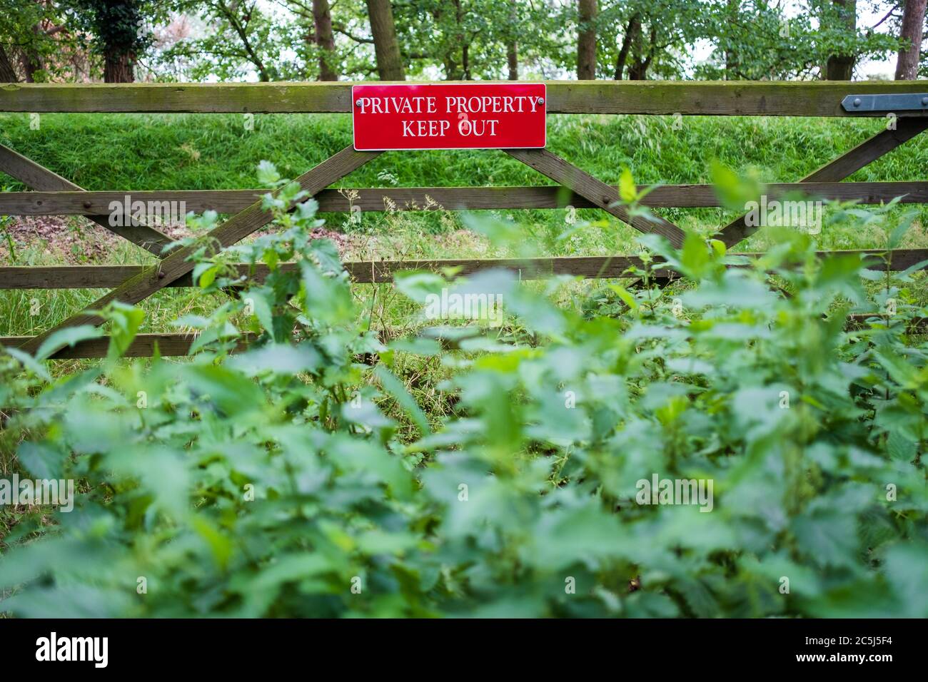 Warning sign with nettles hi-res stock photography and images - Alamy