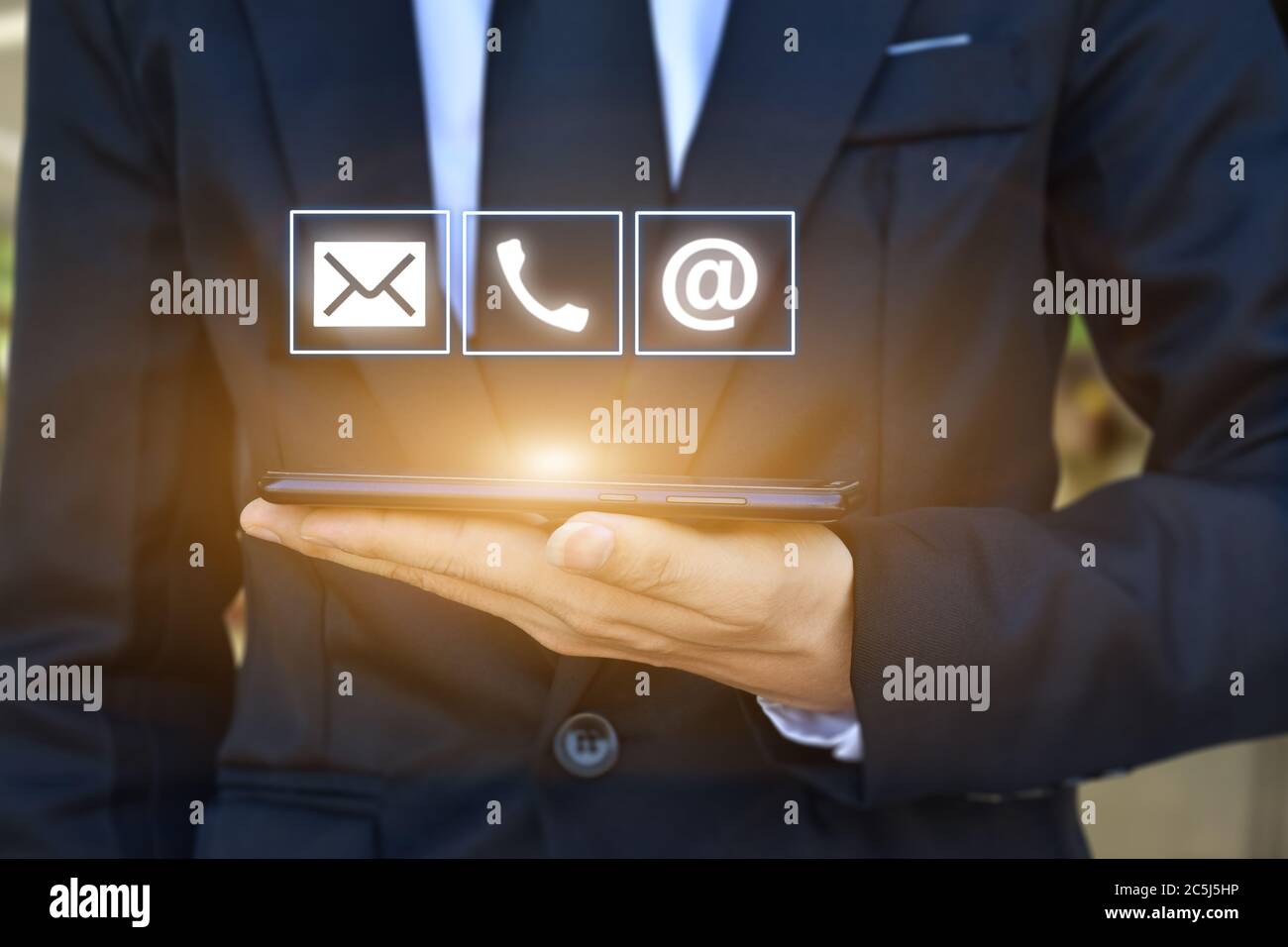 CONTACT US, Businessman hand holding mobile phone with ( address, phone ...