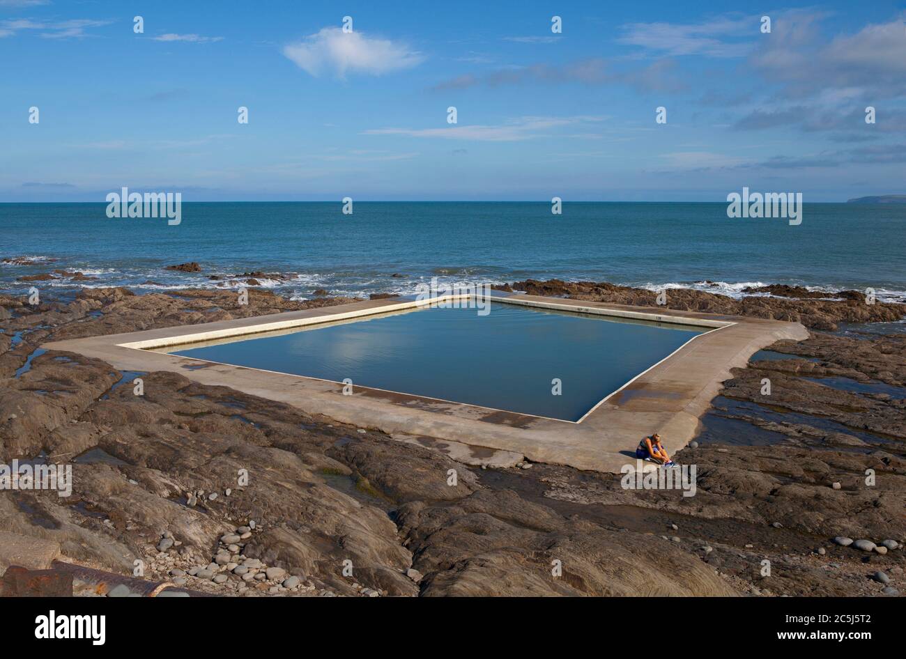 Lady beside the saltwater swimming pool at Westward Ho!, North Devon ...
