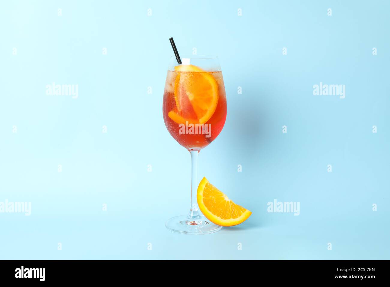 Aperol spritz cocktail on blue background. Summer drink Stock Photo - Alamy