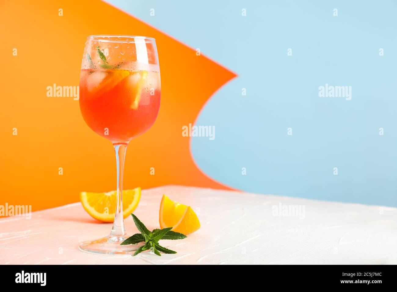 Composition with aperol spritz cocktail on color background. Summer ...