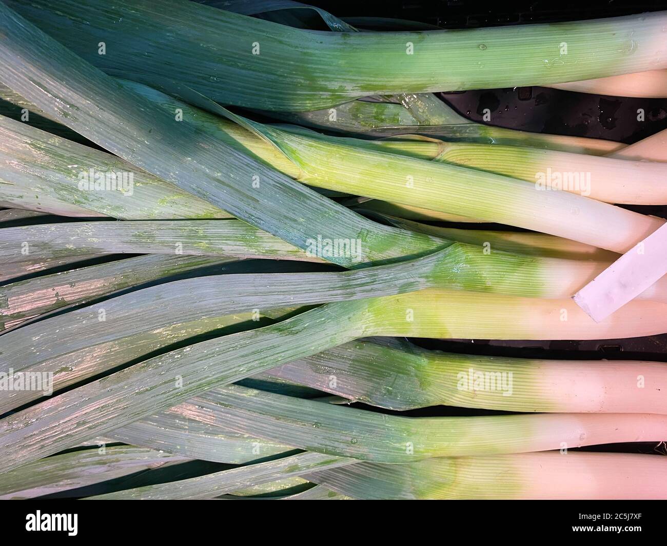 Leeks and green vegetables at farmers market hi-res stock photography ...