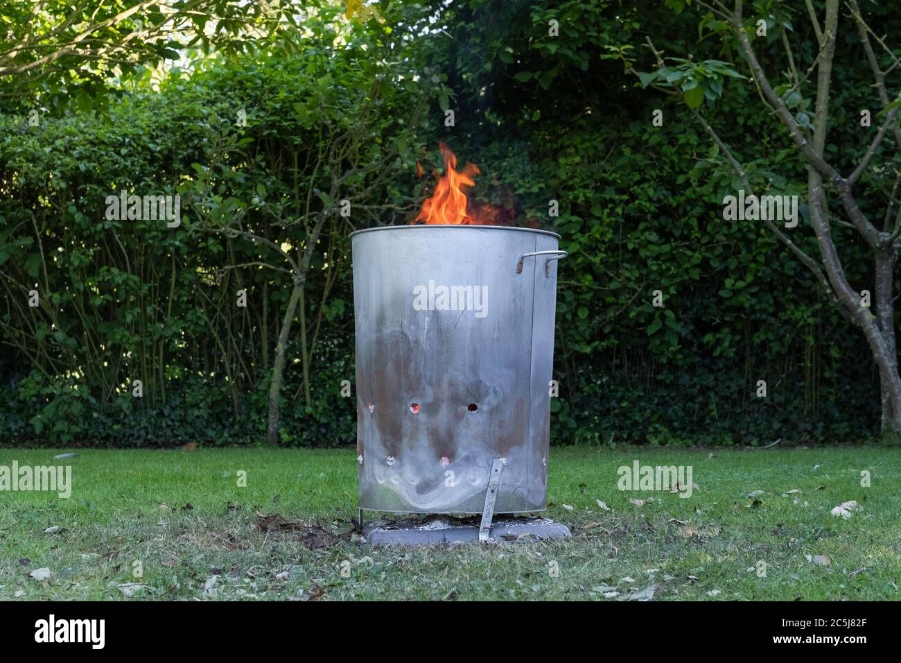 Burning waste in garden incinerator hi-res stock photography and images ...
