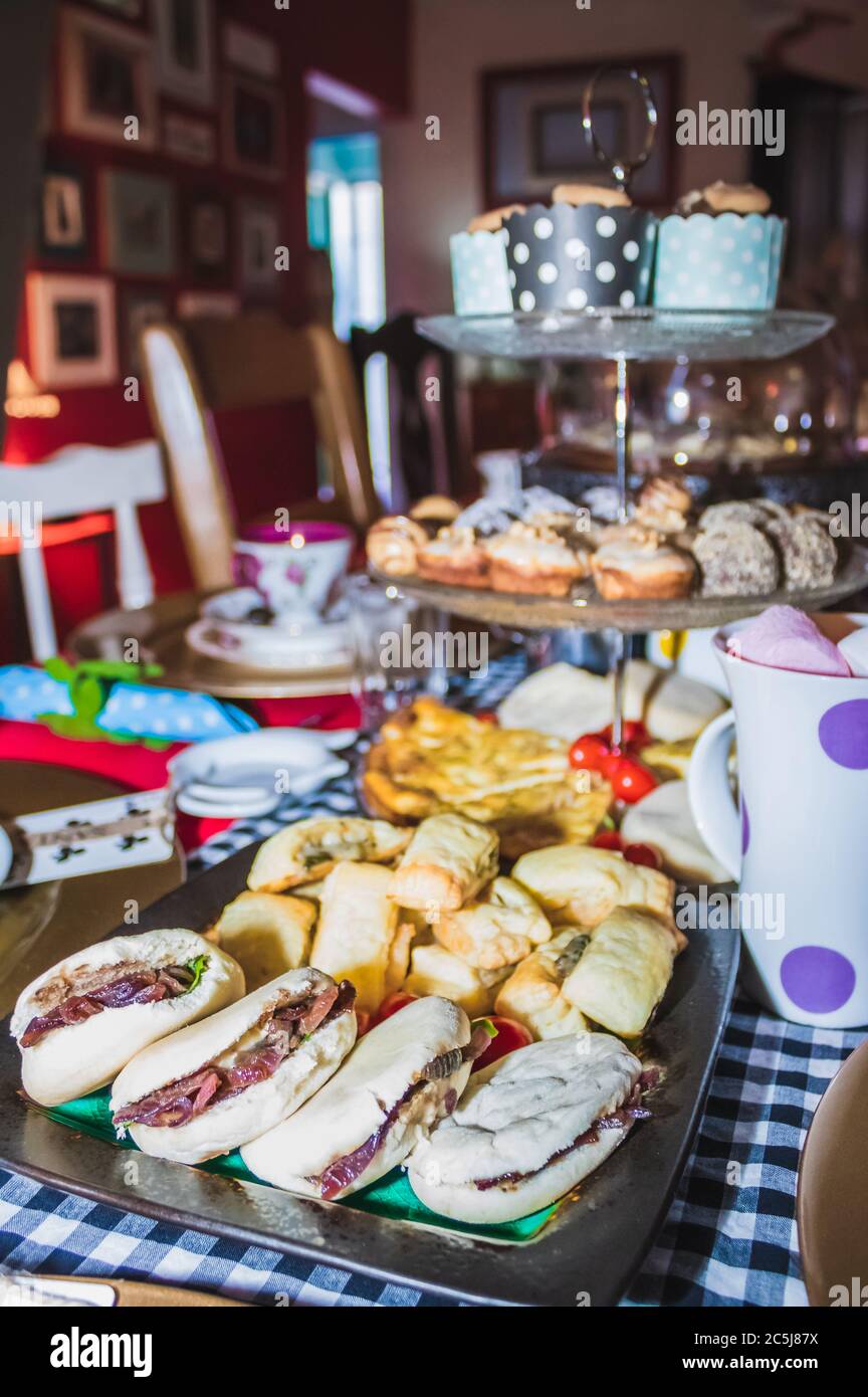 Colorful Tea party with chocolate cupcakes, biscuits, muffins, sweet ...