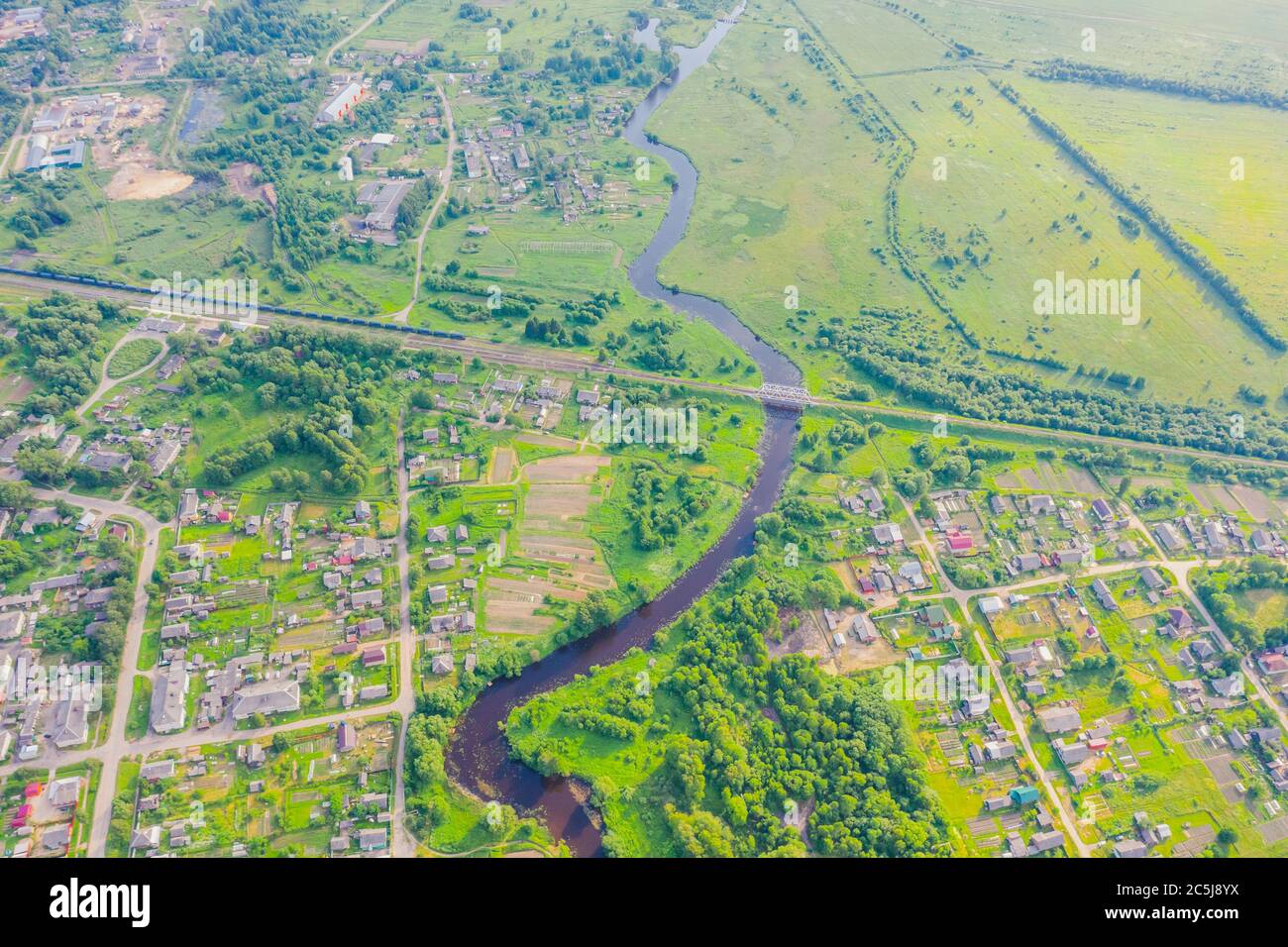 Aerial view landscape of winding small river among the small town ...