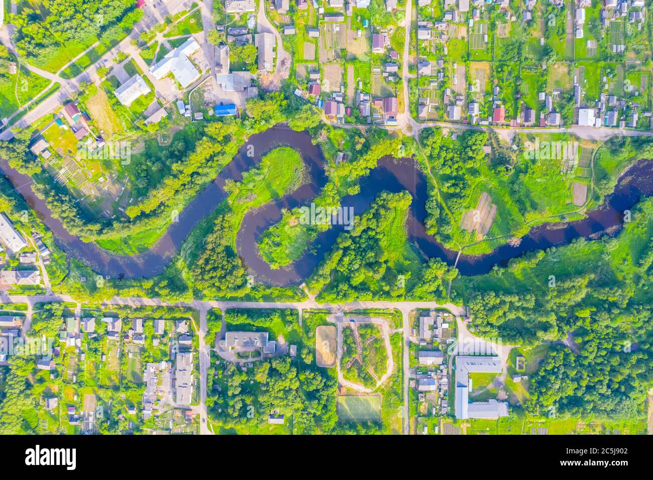 Aerial view landscape of winding small river among the small town ...