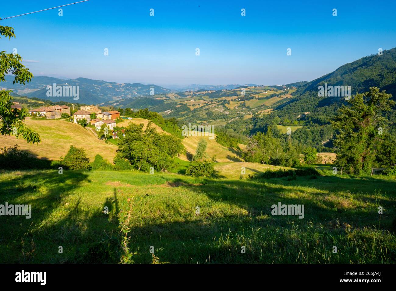 Italian countryside with fields, trees, grass, and meadows around ...