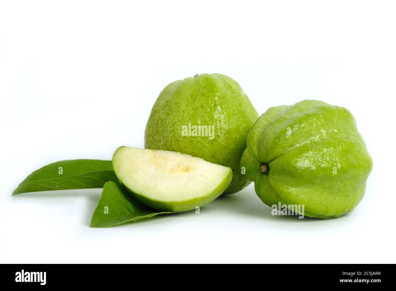 Green crystal guava raw fruit and sliced with leaves isolated on a ...