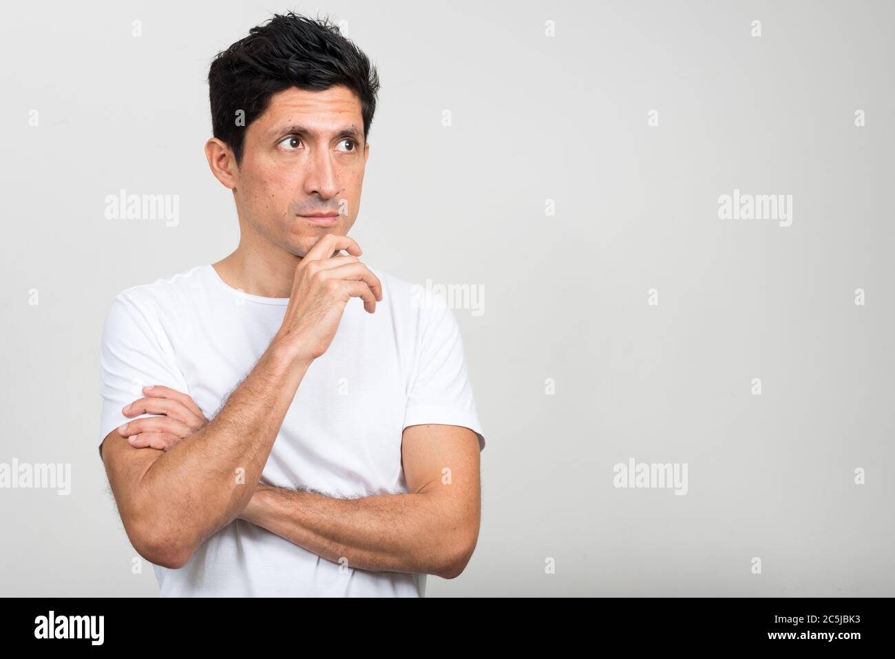 Portrait of Hispanic man thinking and looking up Stock Photo - Alamy