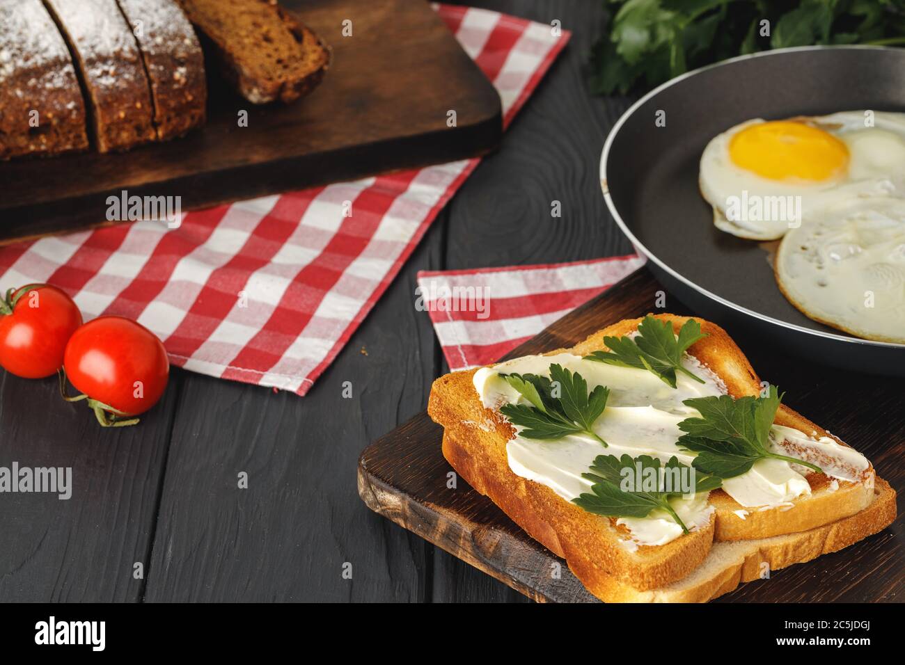 Simple breakfast. Toasted bread covered with butter Stock Photo - Alamy
