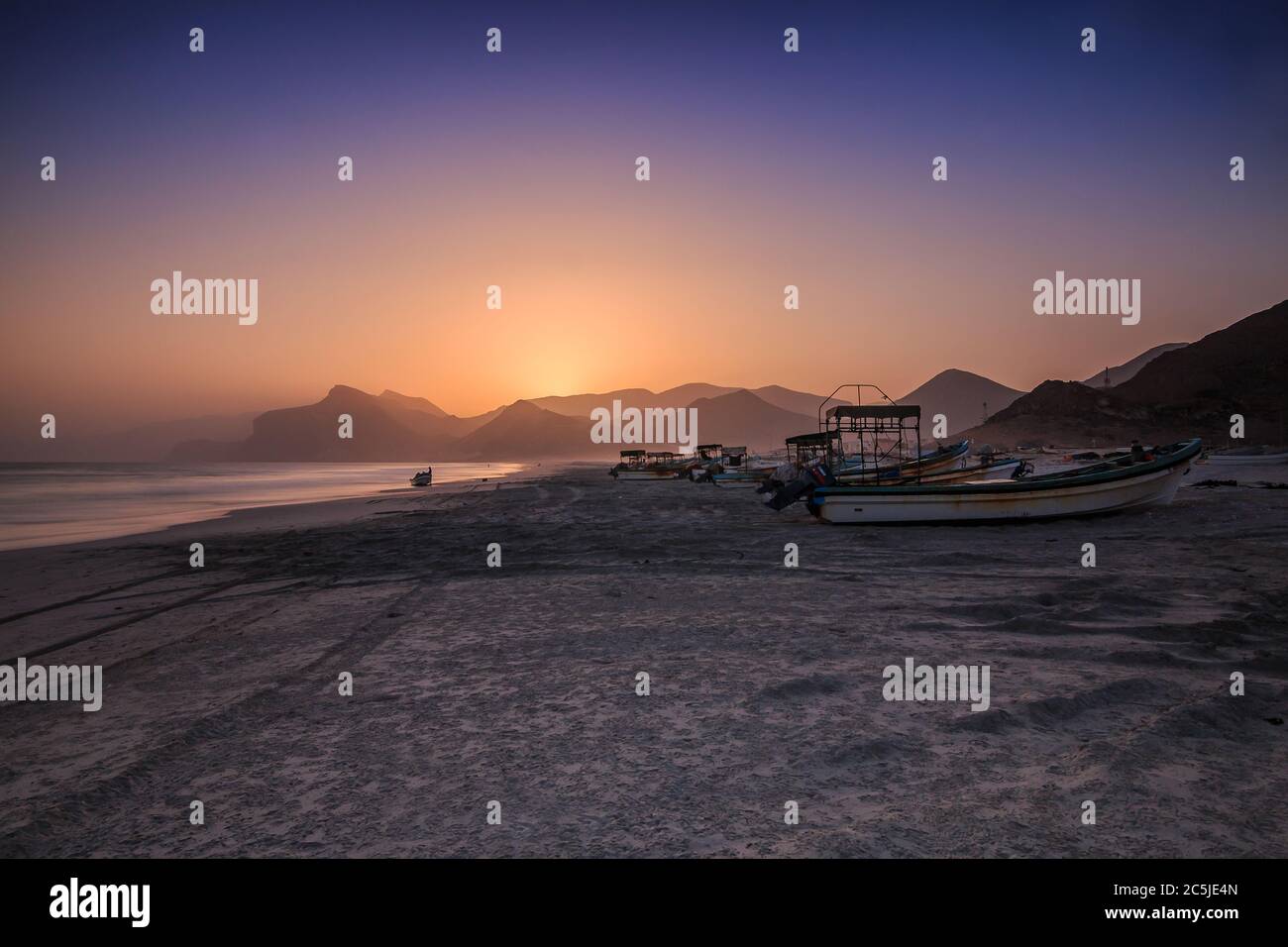 Sunset with blue and orange skies in Oman on Salalah mughsail beach ...