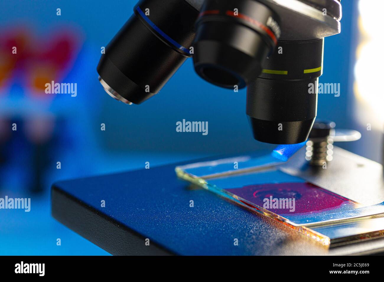 Close up photo of a microscope lenses examining glass sample Stock ...