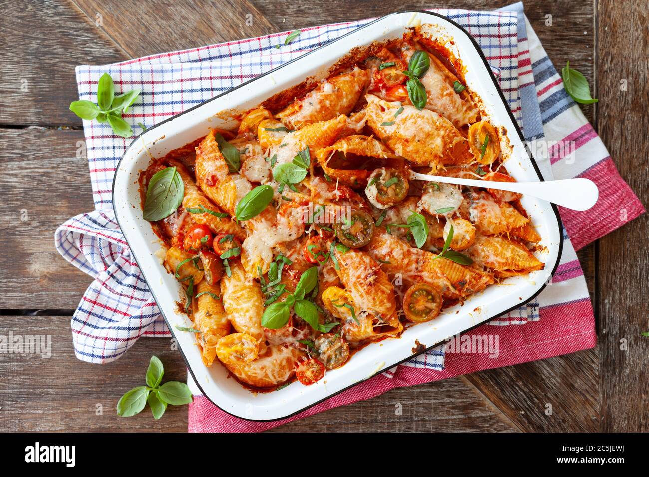 Shell pasta in homemade tomato sauce, baked with parmesan Stock Photo ...