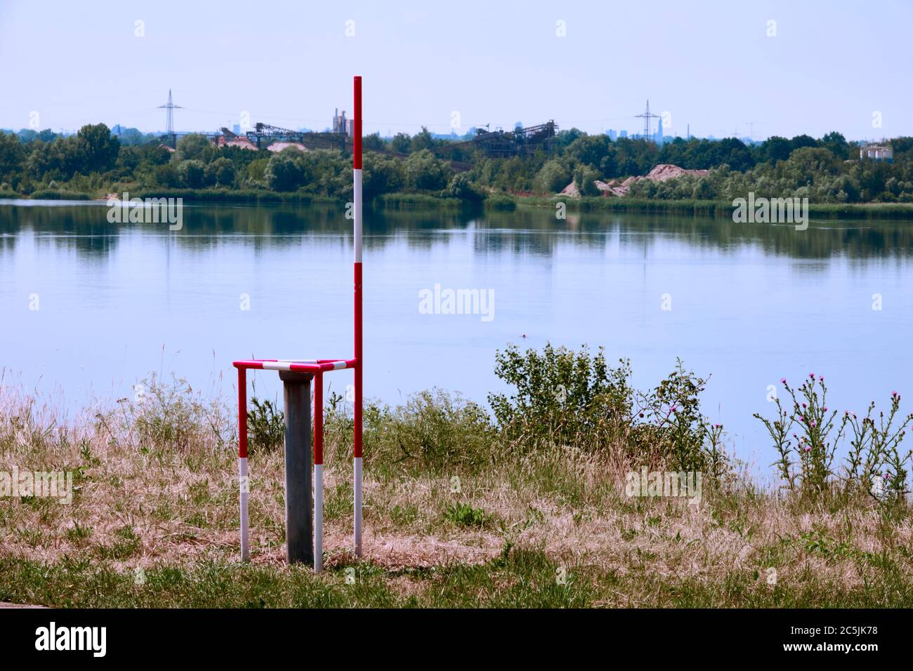 Well with a measuring bar for monitoring the groundwater level and ...