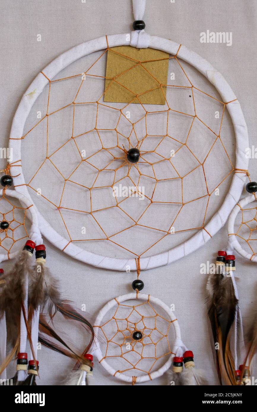 Real native dream catcher on pure white background Stock Photo - Alamy