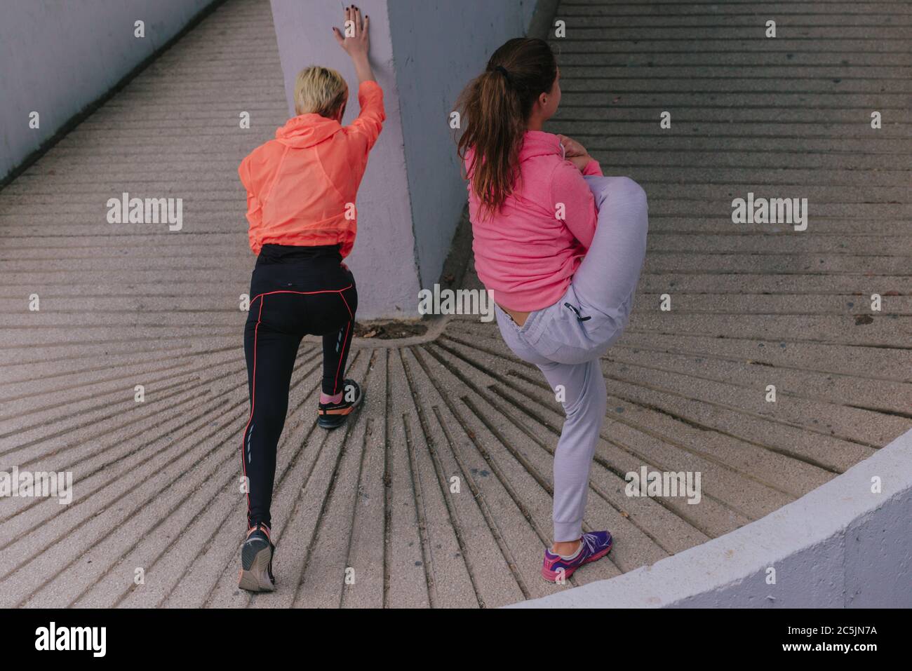 Healthy lifestyle athletes dressed in training clothes exercising Stock ...