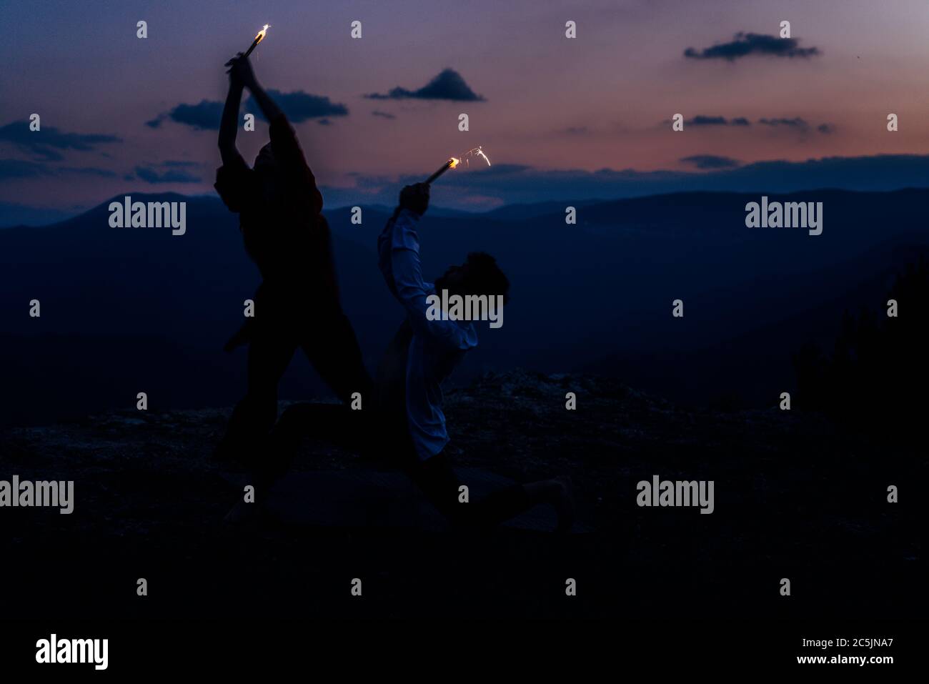 Group celebrating dusk silhouette hi-res stock photography and images ...