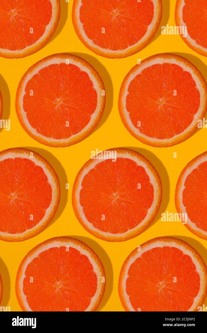 Grapefruit pattern on yellow background. Minimal flat lay concept Stock ...