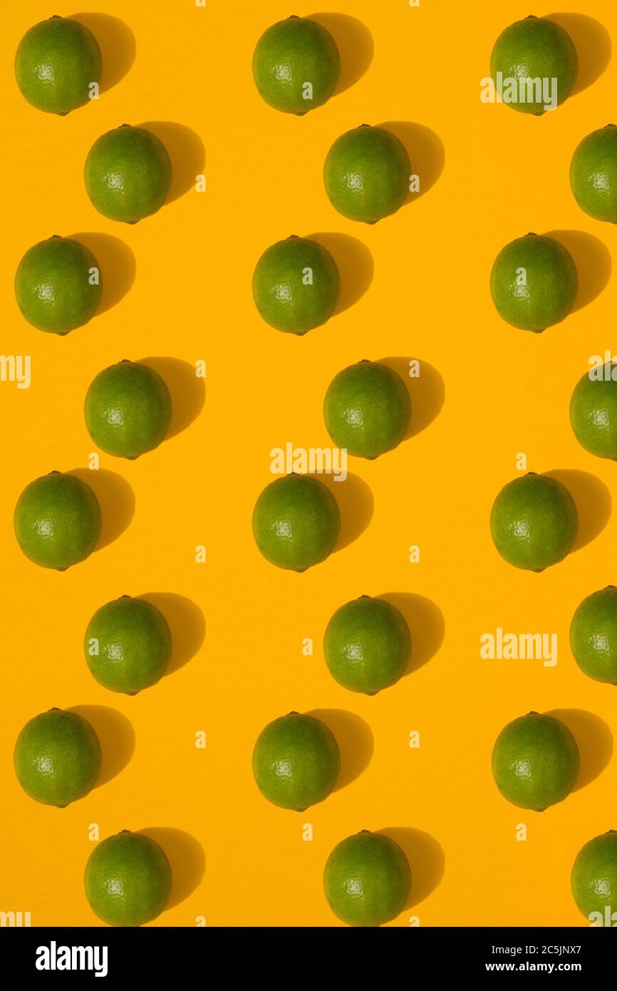 Lime pattern on yellow background. Minimal flat lay concept Stock Photo ...