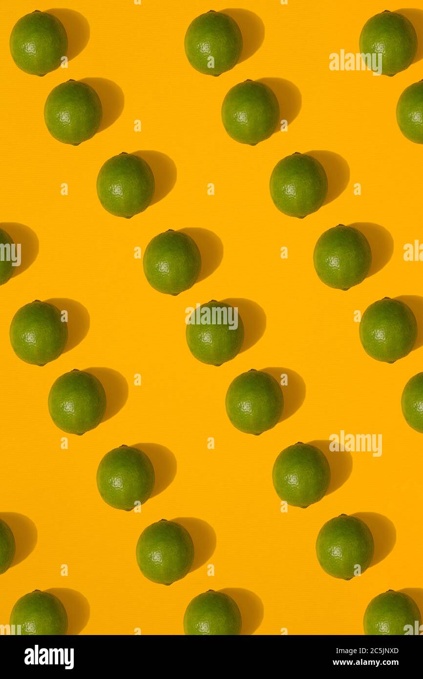 Lime pattern on yellow background. Minimal flat lay concept Stock Photo ...