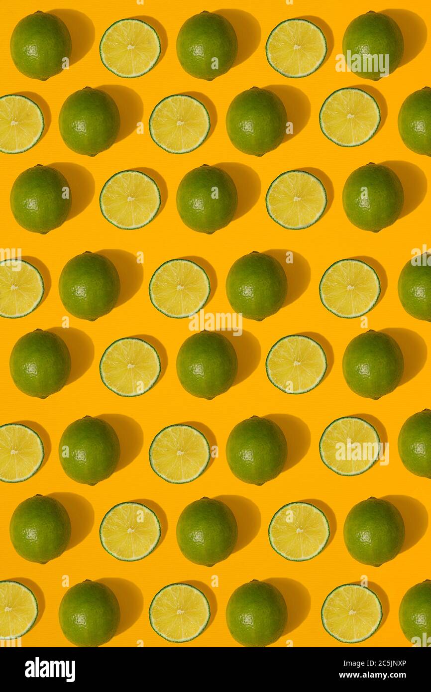 Lime pattern on yellow background. Minimal flat lay concept Stock Photo ...