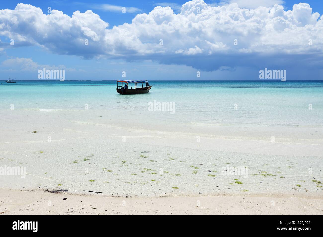 Blue transparent water and motor fishing boat in Indian ocean, Kendwa ...