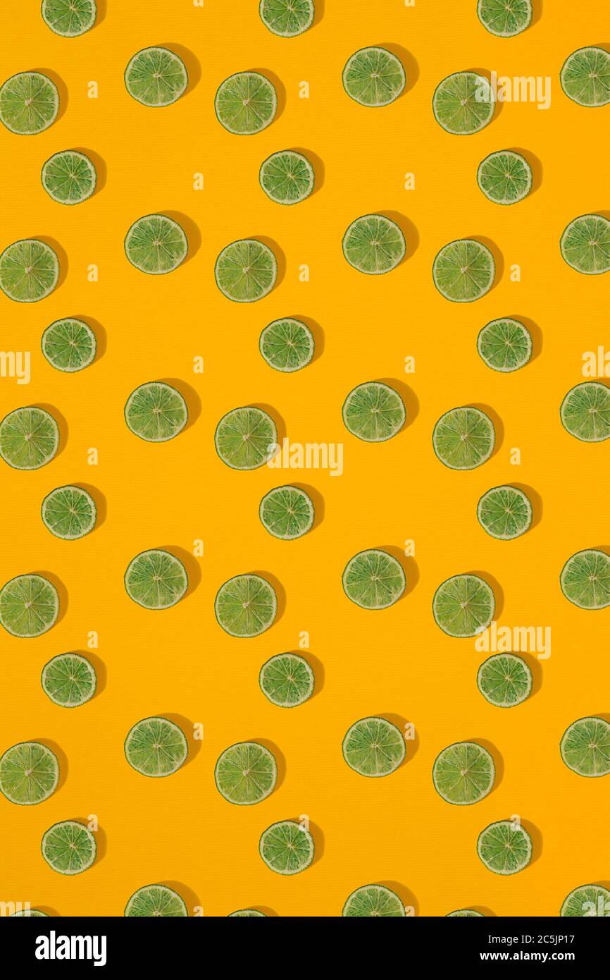Lime pattern on yellow background. Minimal flat lay concept Stock Photo ...