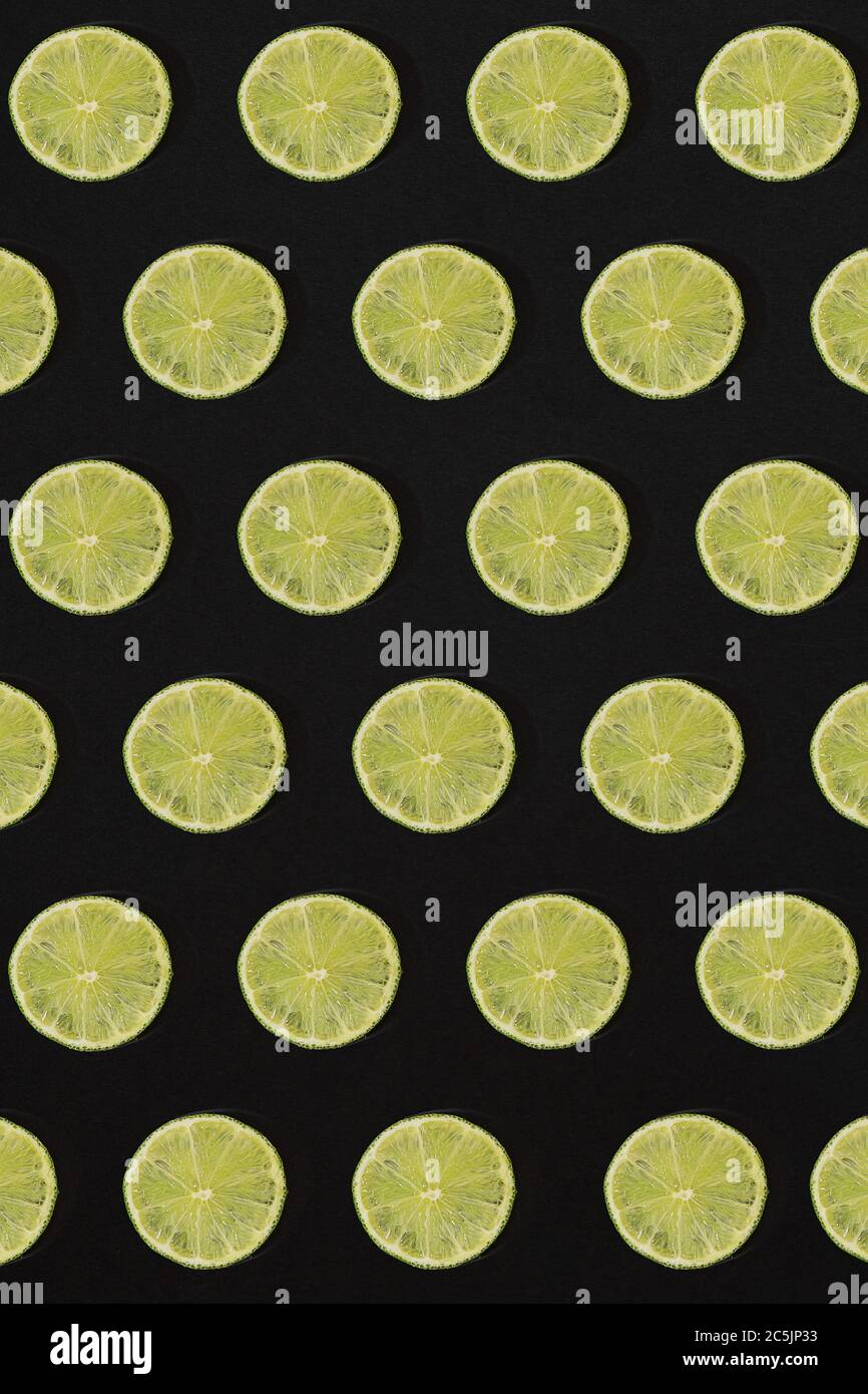 Lime pattern on black background. Minimal flat lay concept Stock Photo ...