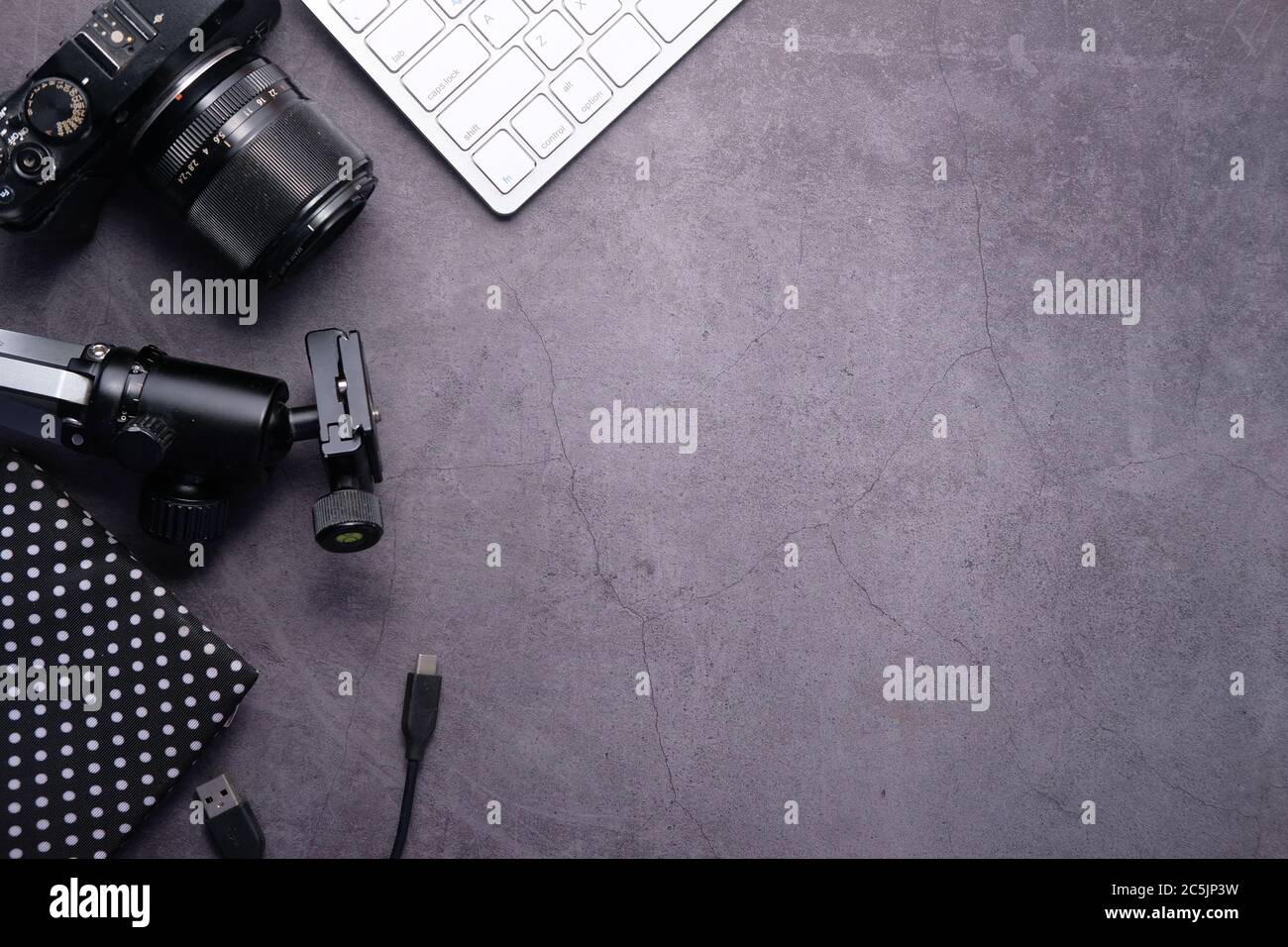 Flat lay camera and equipment on working desk Stock Photo - Alamy