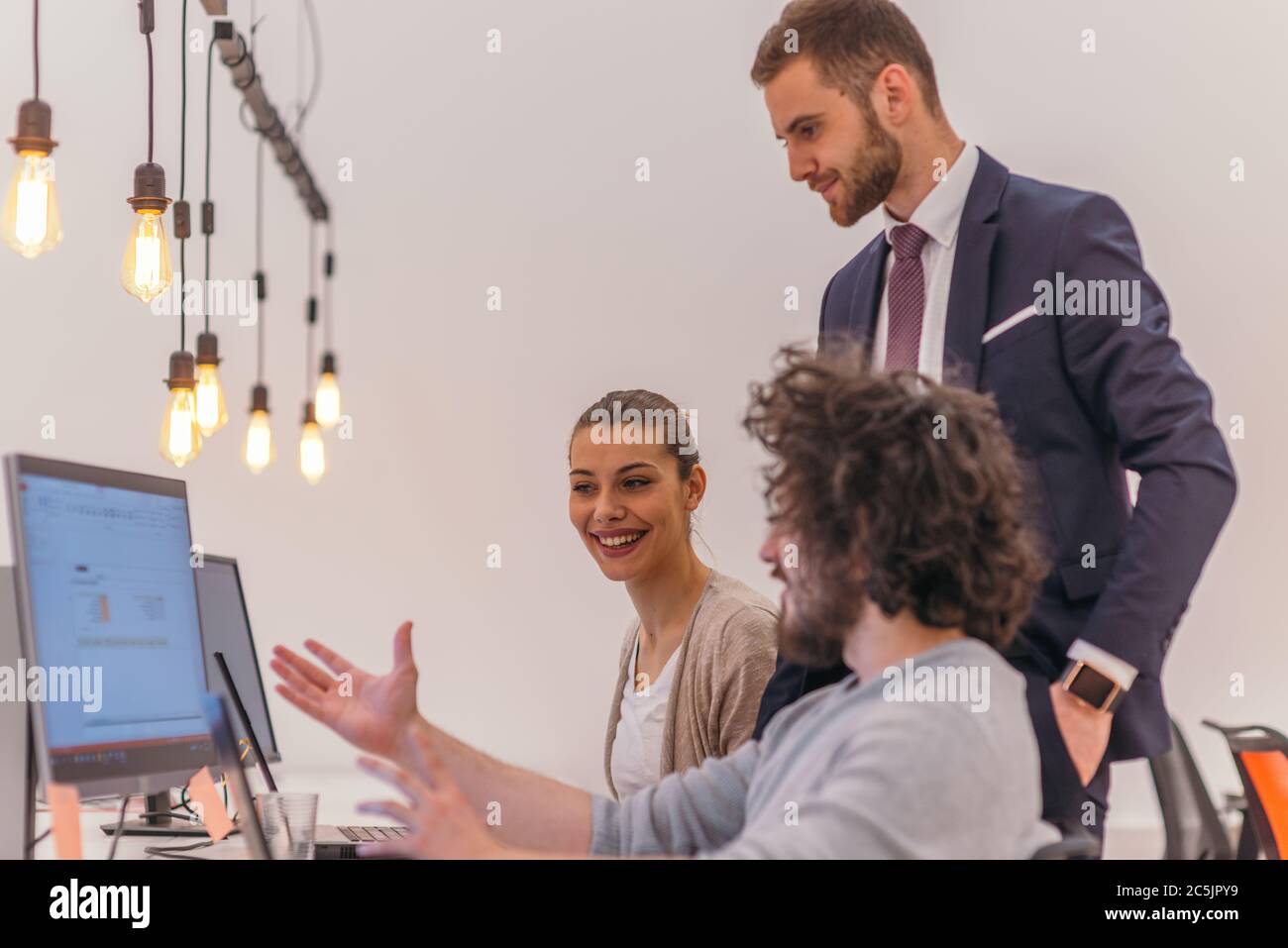 Manager overseeing his employees beautiful blonde and a coworker with ...