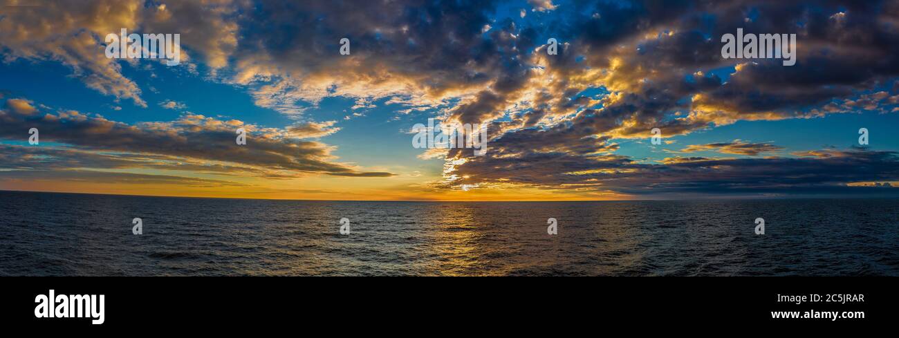 Beautiful sunset at the beach in a summer morning Stock Photo - Alamy
