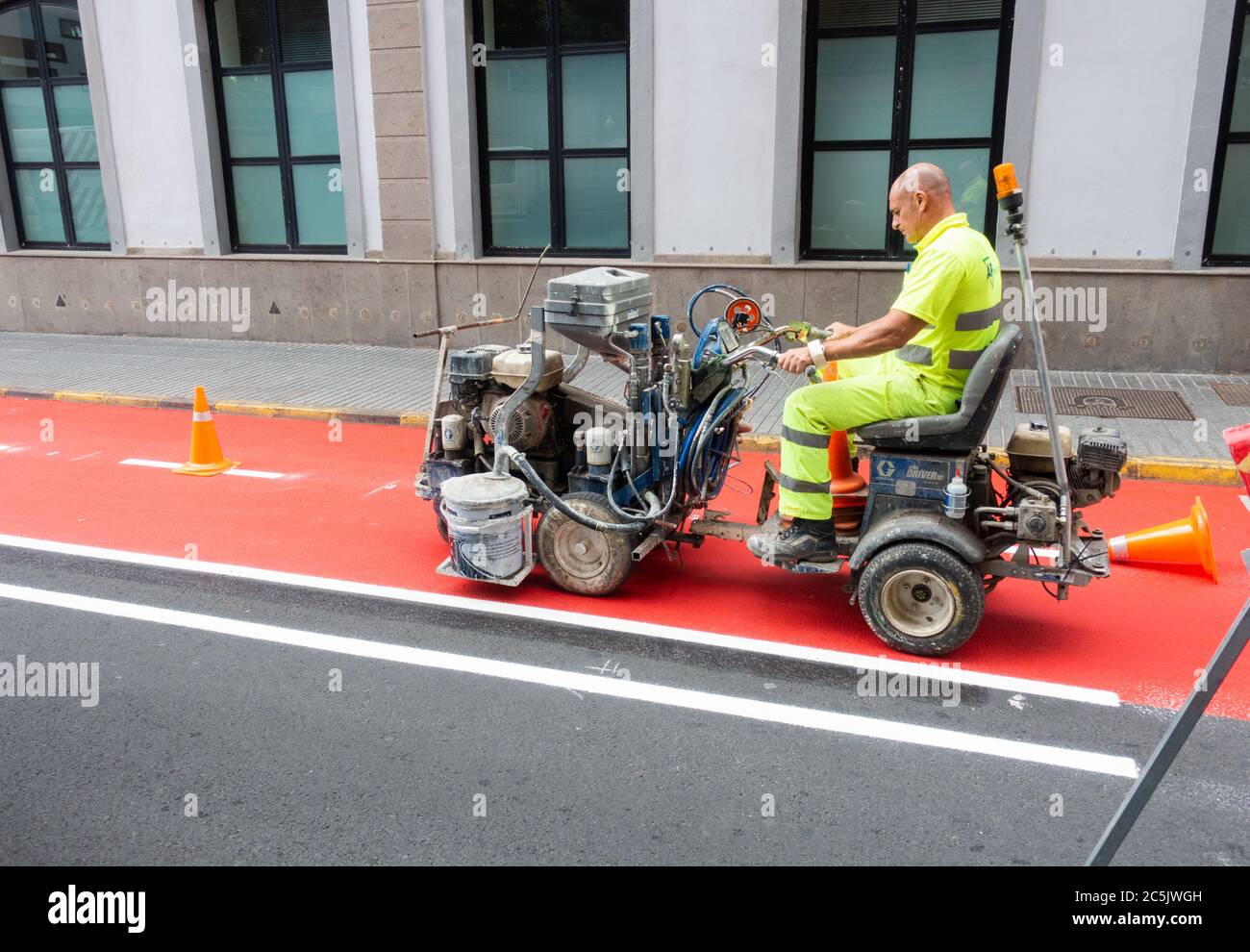 New cycle, bike lane, path being painted in city street in Spain Stock ...