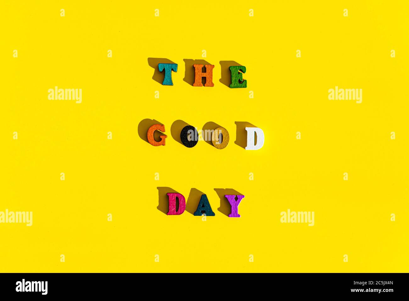 layout of wood multicolored letters is inscription of good day with ...