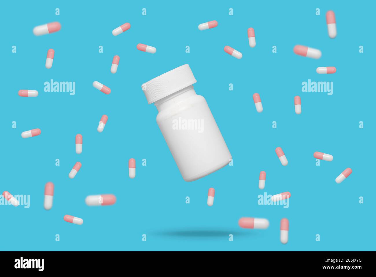 Red and white medicine pills tablets capsules floating around a ...
