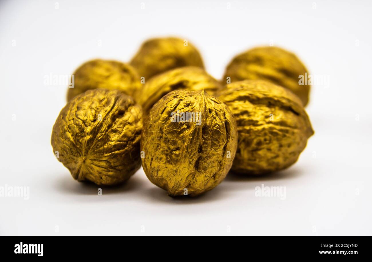 A golden walnuts on a white background Stock Photo - Alamy