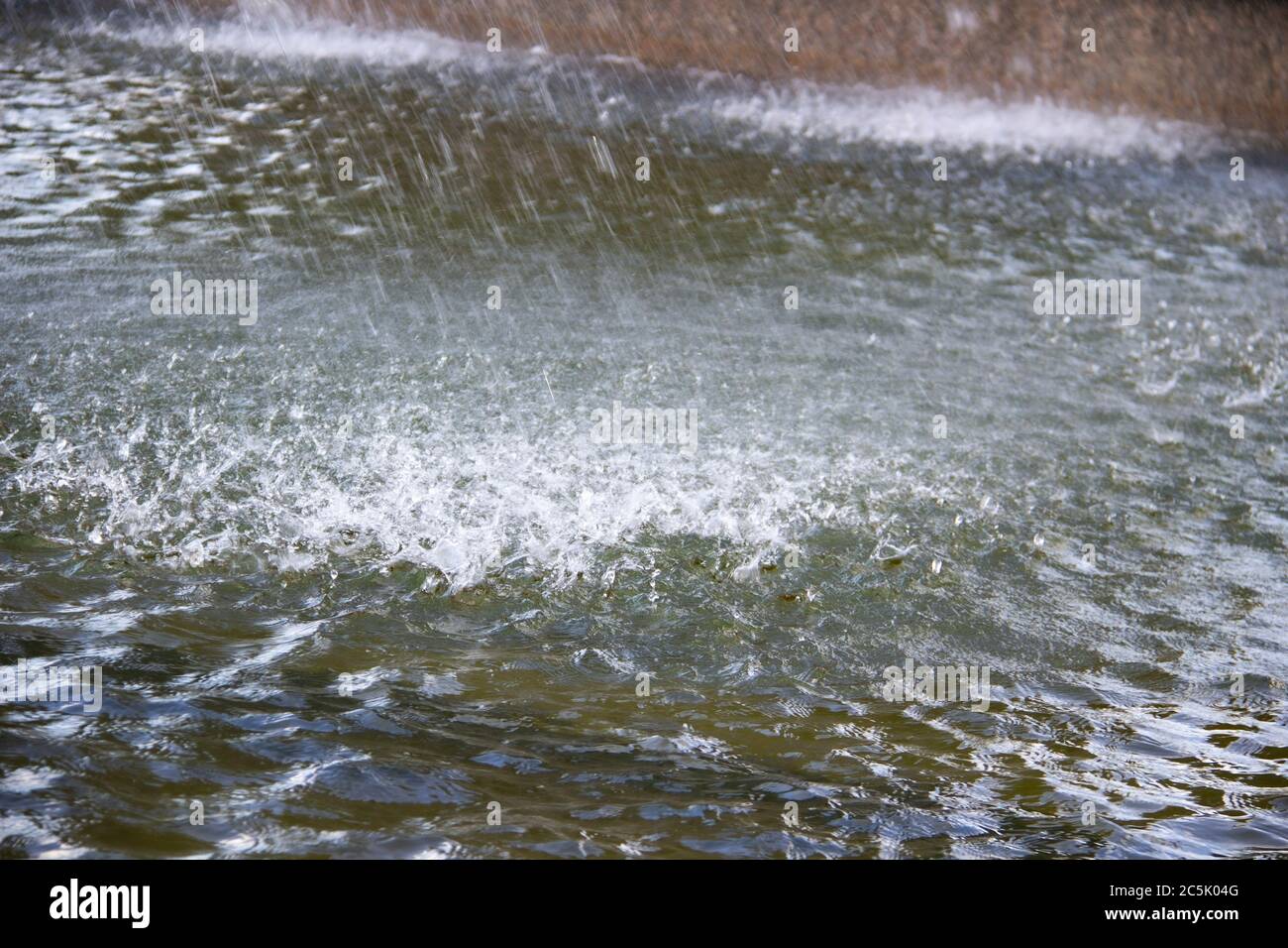 A splashing water in the water Stock Photo - Alamy