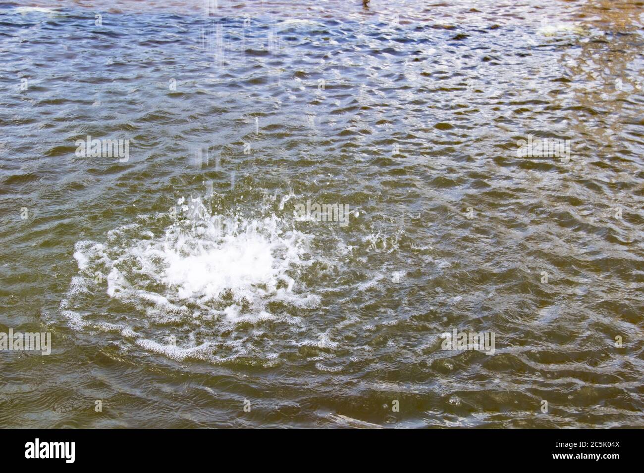 A splashing water in the water Stock Photo - Alamy