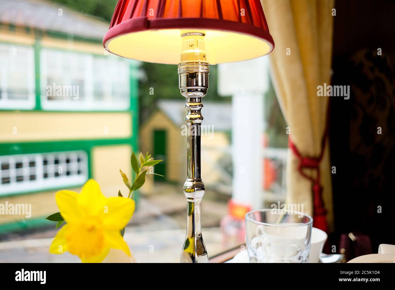 Shallow focus of an ornate dining table lamp seen in a First Class ...