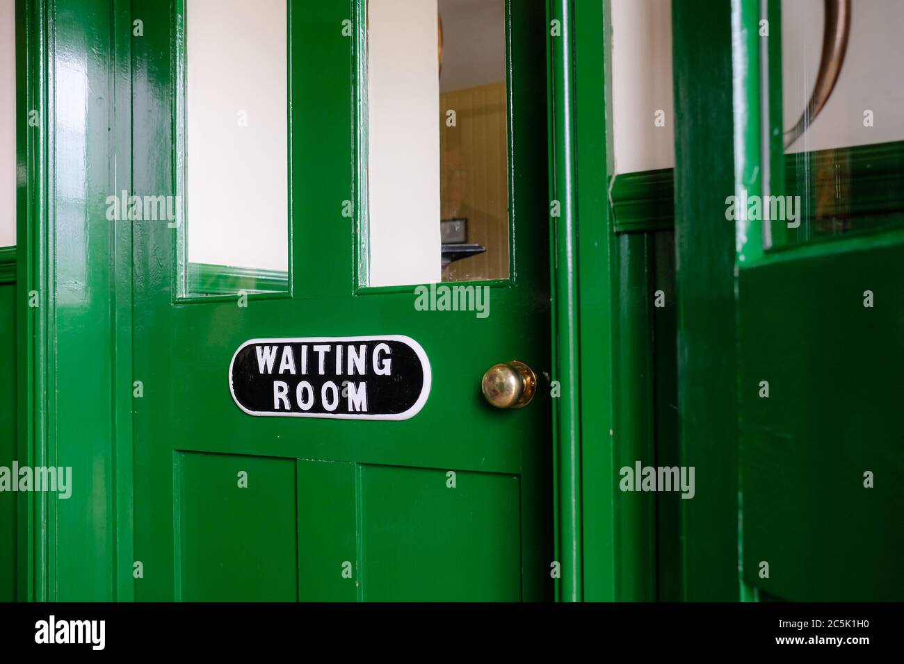 Traditional interior view of a bygone era railway waiting room. Showing ...