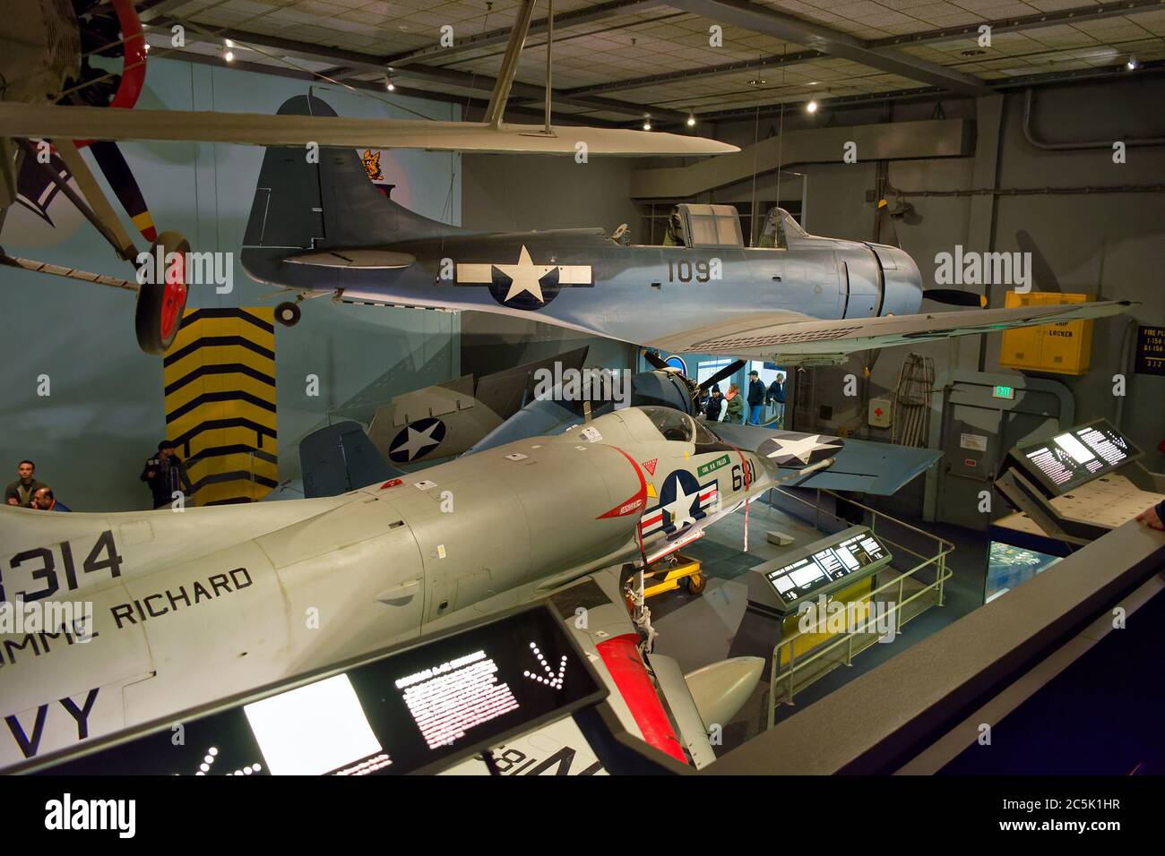 Visitors looking at various U.S. Navy airplanes in the Naval aviation ...