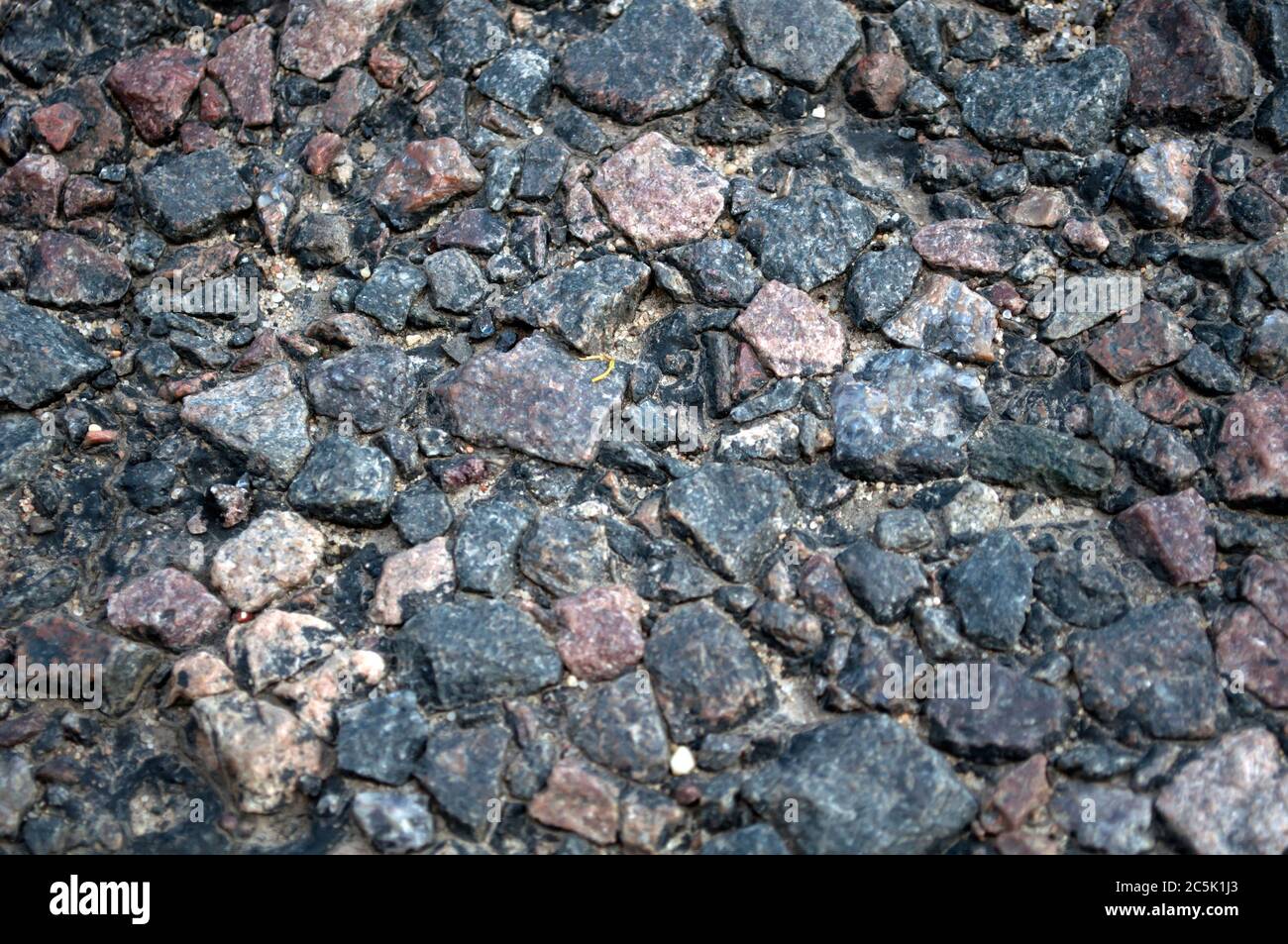 Stone hard road surface. Old technology of road construction. Grained ...