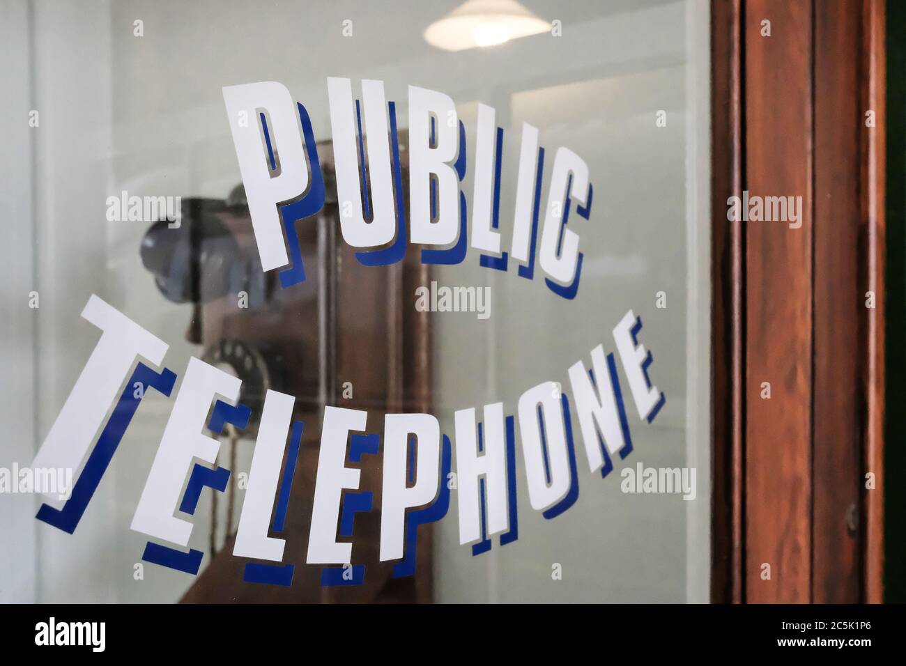 Shallow focus of Public Telephone decals seen on the door of a vintage ...
