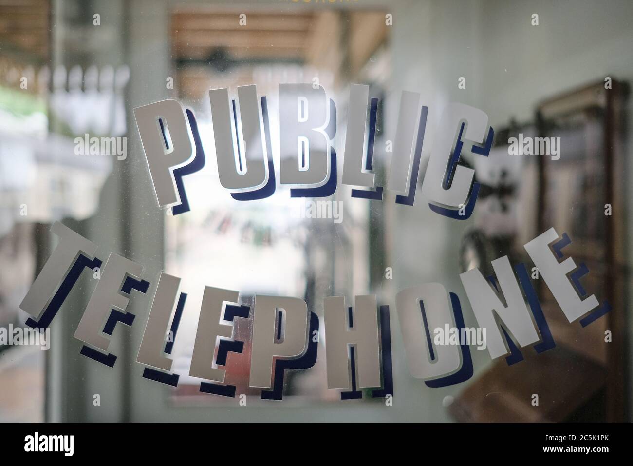 Shallow focus of Public Telephone decals seen on the door of a vintage ...