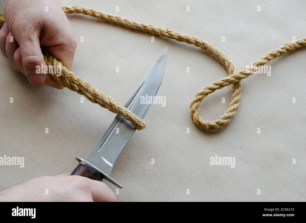 Cut rope knife knot hi-res stock photography and images - Alamy