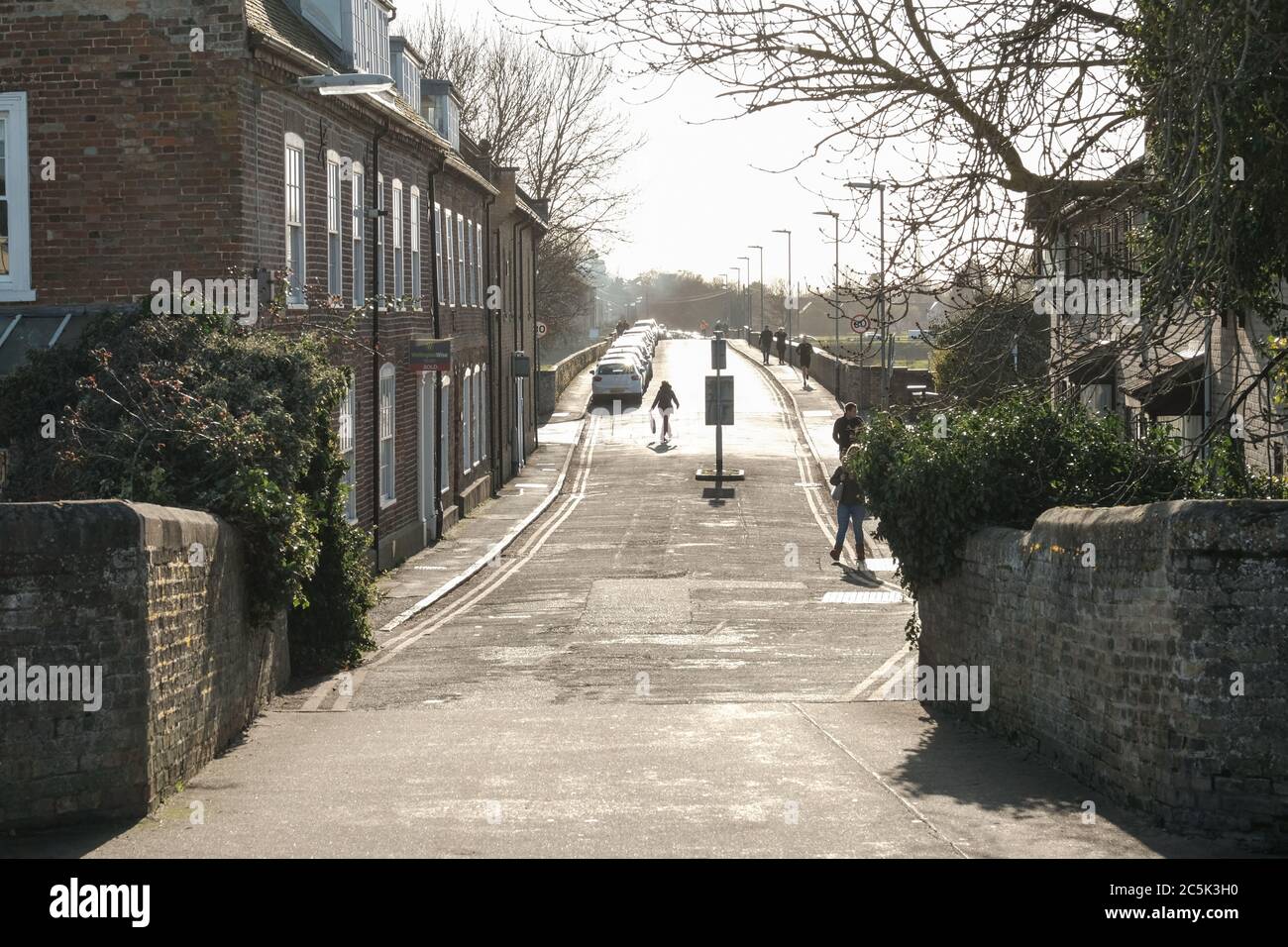 High contrast view of an empty road seen from an old toll bridge in an ...