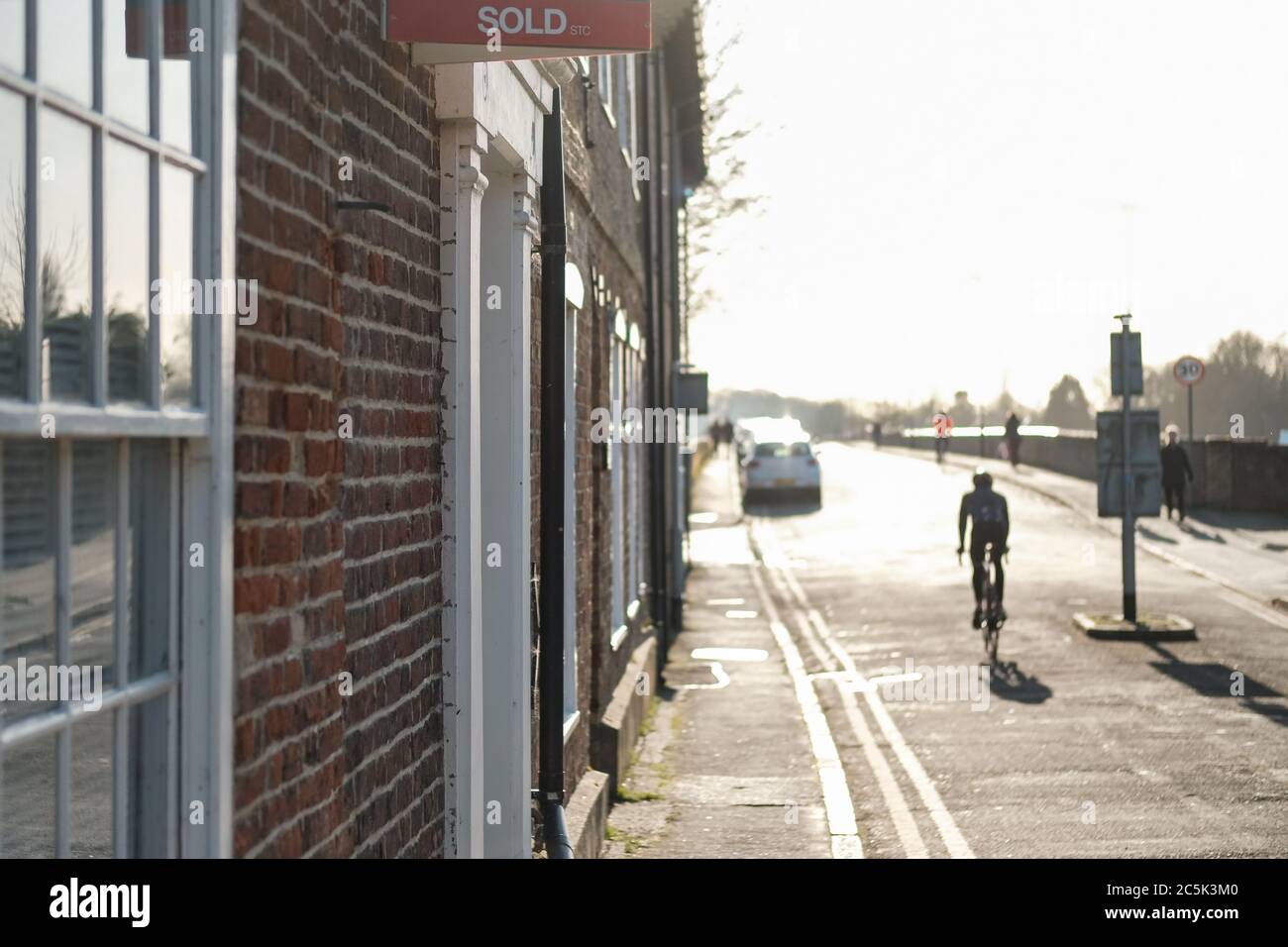 High contrast view of an empty road seen from an old toll bridge in an ...